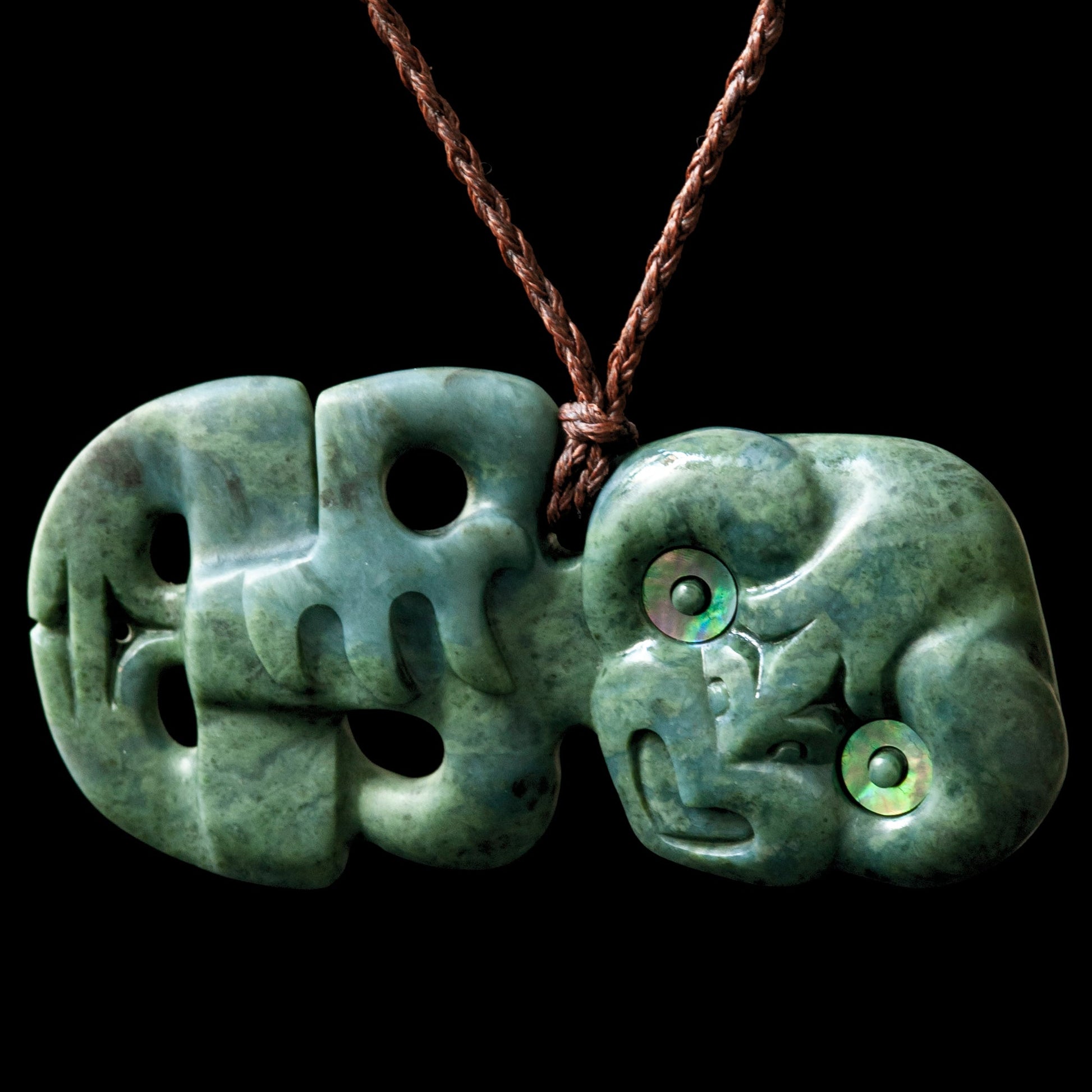 Dark Jade Hei Tiki with Paua Karu by Tim Steel Pendant - Buy Kiwi Direct